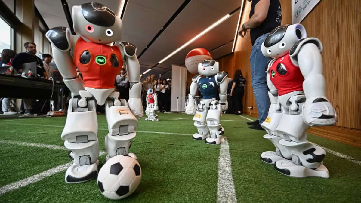 A Team of Nao Robots Play a Game of Soccer During the AI for Good ...